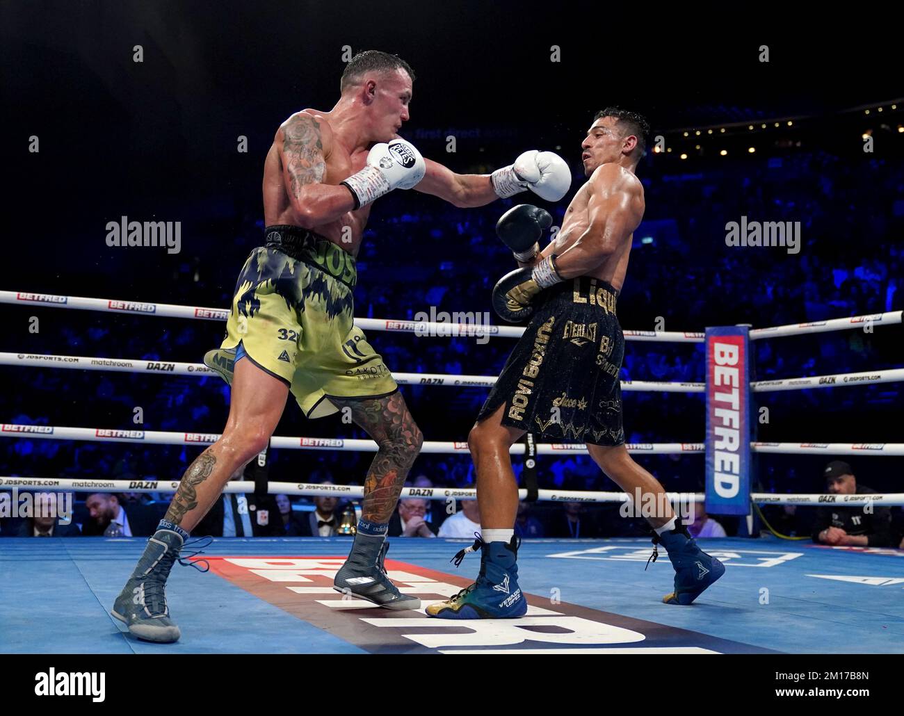 Josh Warrington (left) and Luis Alberto Lopez in action in their IBF ...