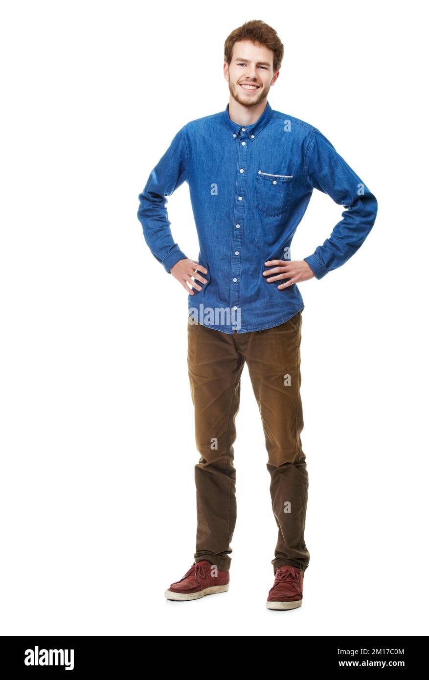 Casually handsome. A full length portrait of a happy young man isolated ...