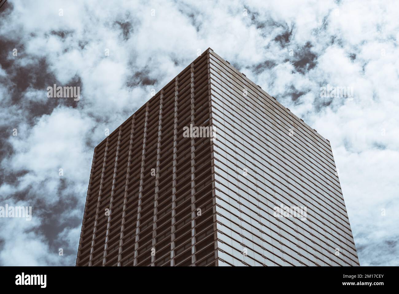 A business tower with a cuboid contemporary architecture with ...