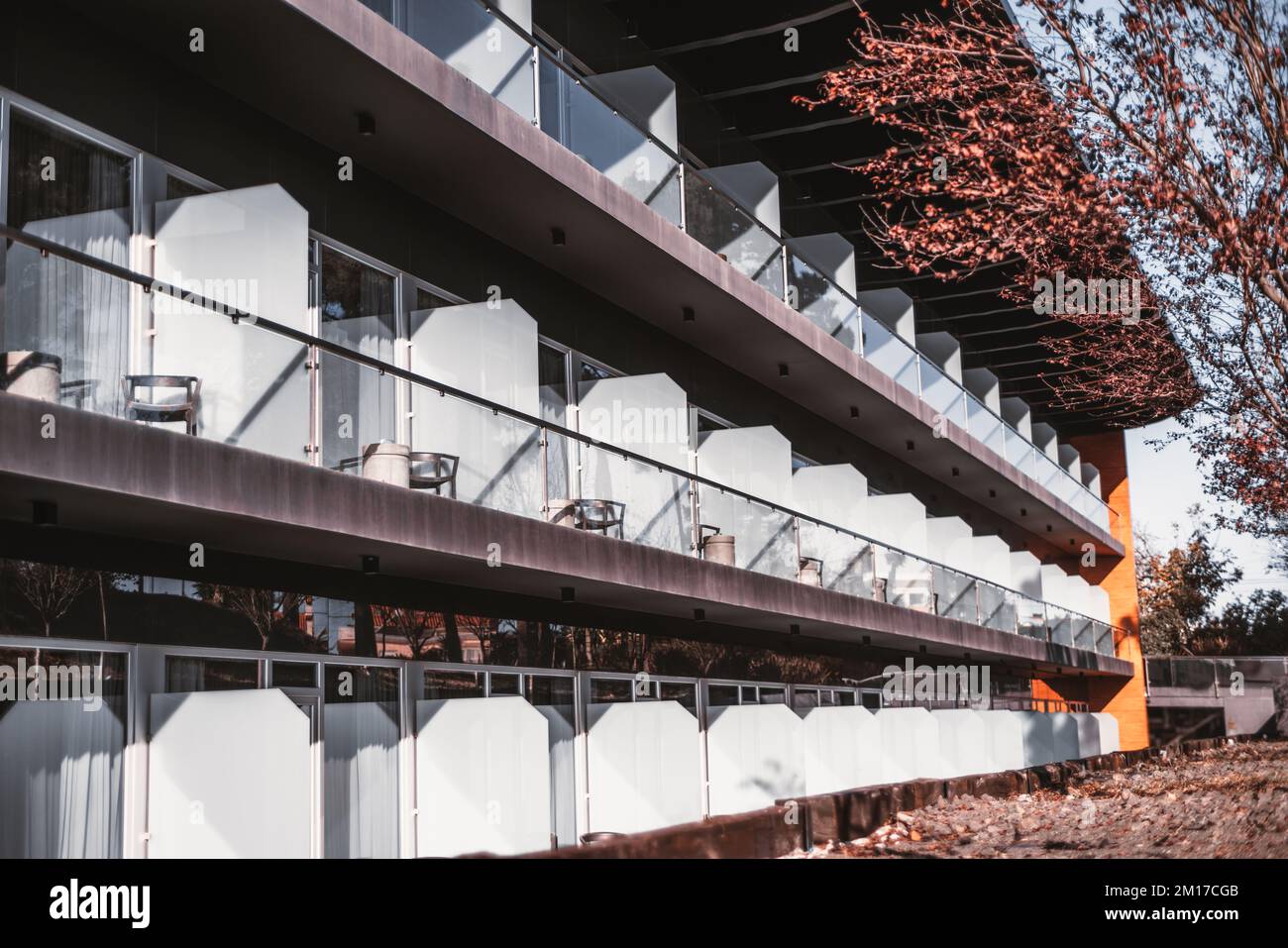 A perspective view of a facade of a modern hotel in a tourist resort ...