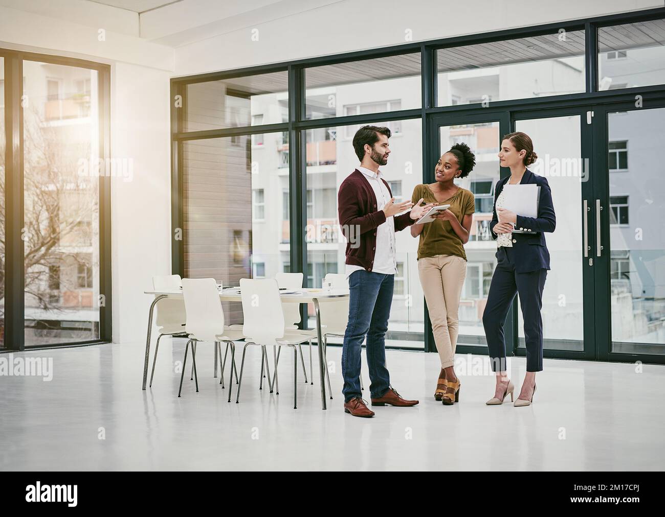 Rolling out a quick update to the team. Shot of a group of colleagues ...