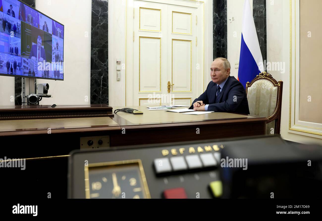 Russian President Vladimir Putin conducts a teleconference from his ...