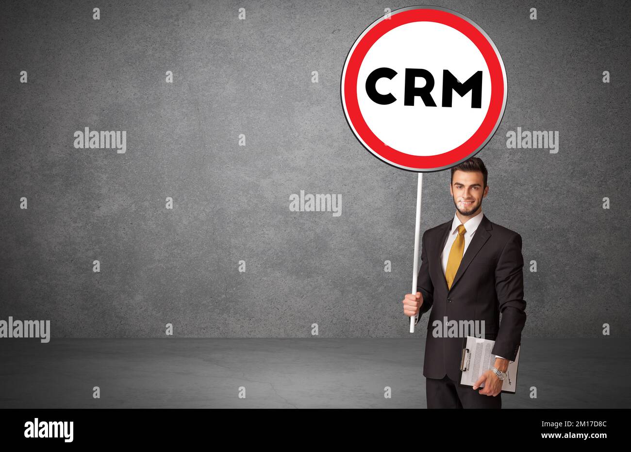 Young business person holdig traffic sign Stock Photo - Alamy