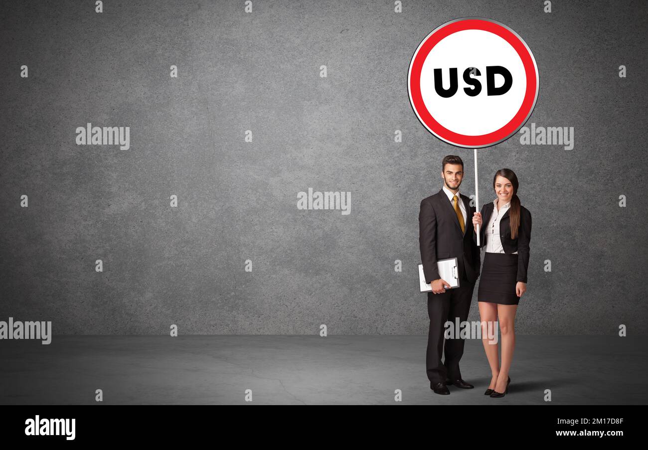Young business person holdig traffic sign Stock Photo - Alamy