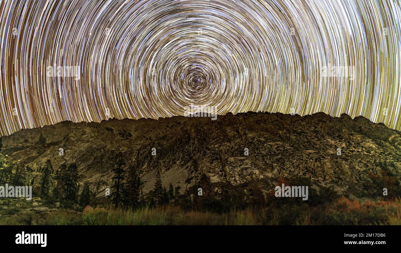Panorama of star trails over the Sierra Nevada mountains Stock Photo ...