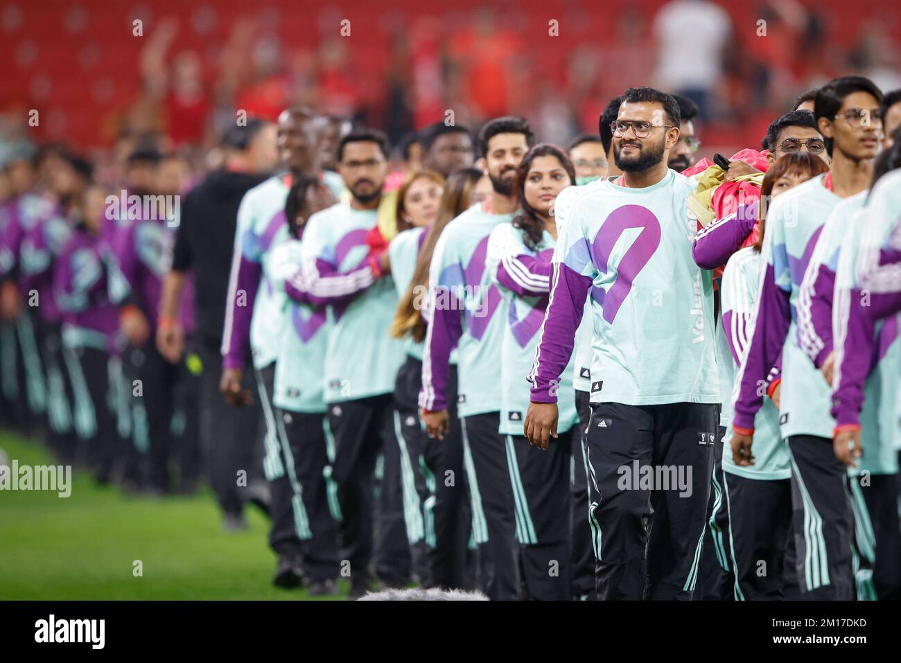 Doha, Qatar. 10th Dec, 2022. Migrant workers during the match between ...