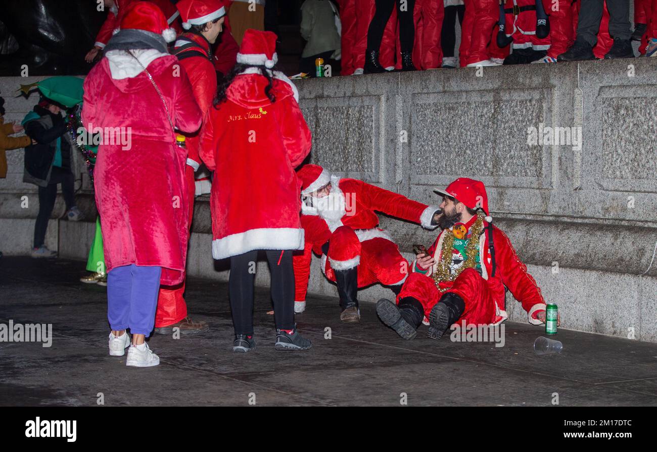 London, England, UK. 10th Dec, 2022. Revellers dressed as Santa are ...