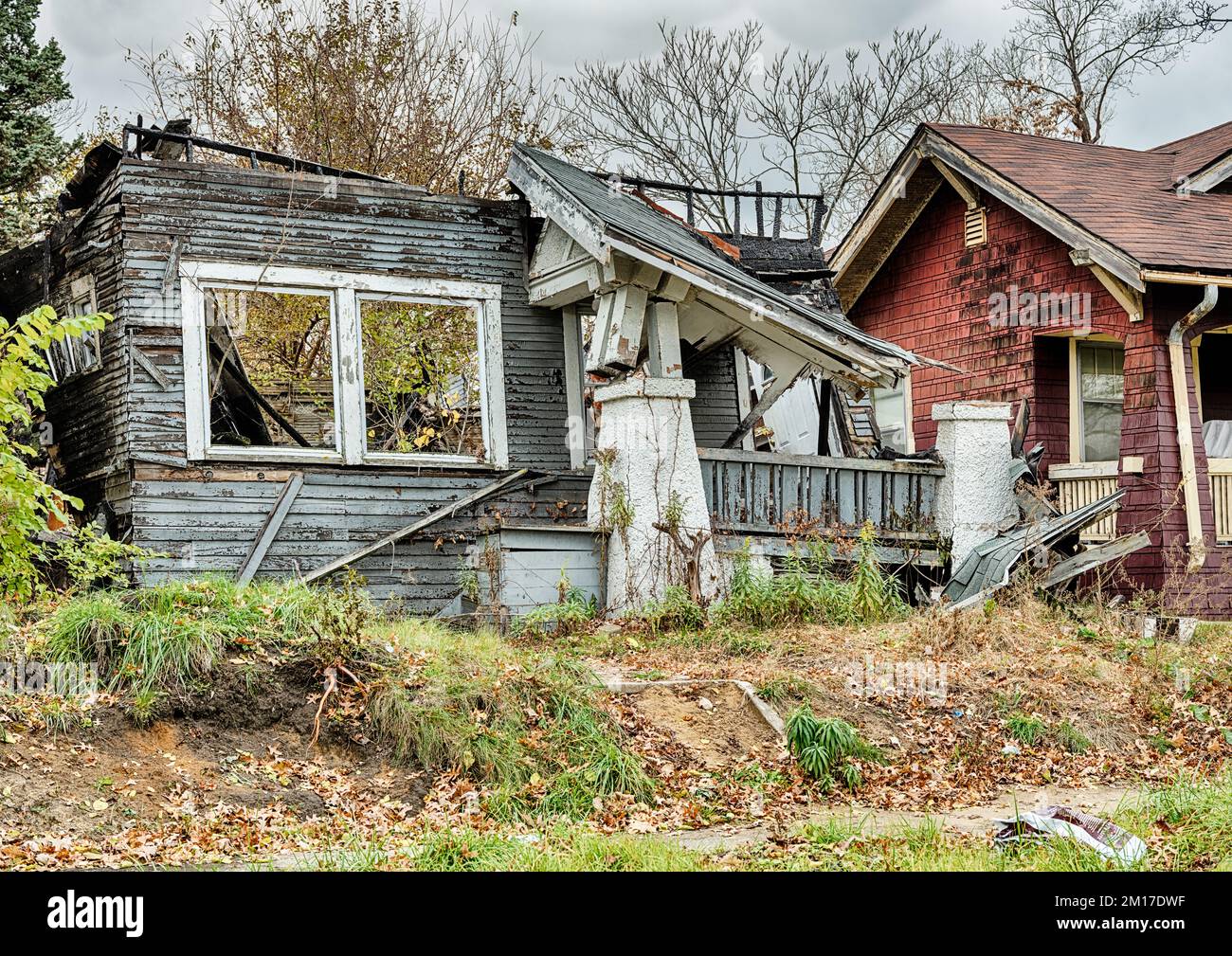 The ruins of a home in a Detroit neighborhood show a collapsed roof ...