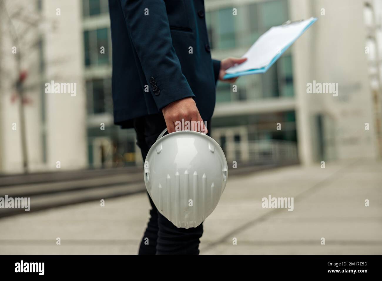 Engineer in suit holding helmet hi-res stock photography and images - Alamy