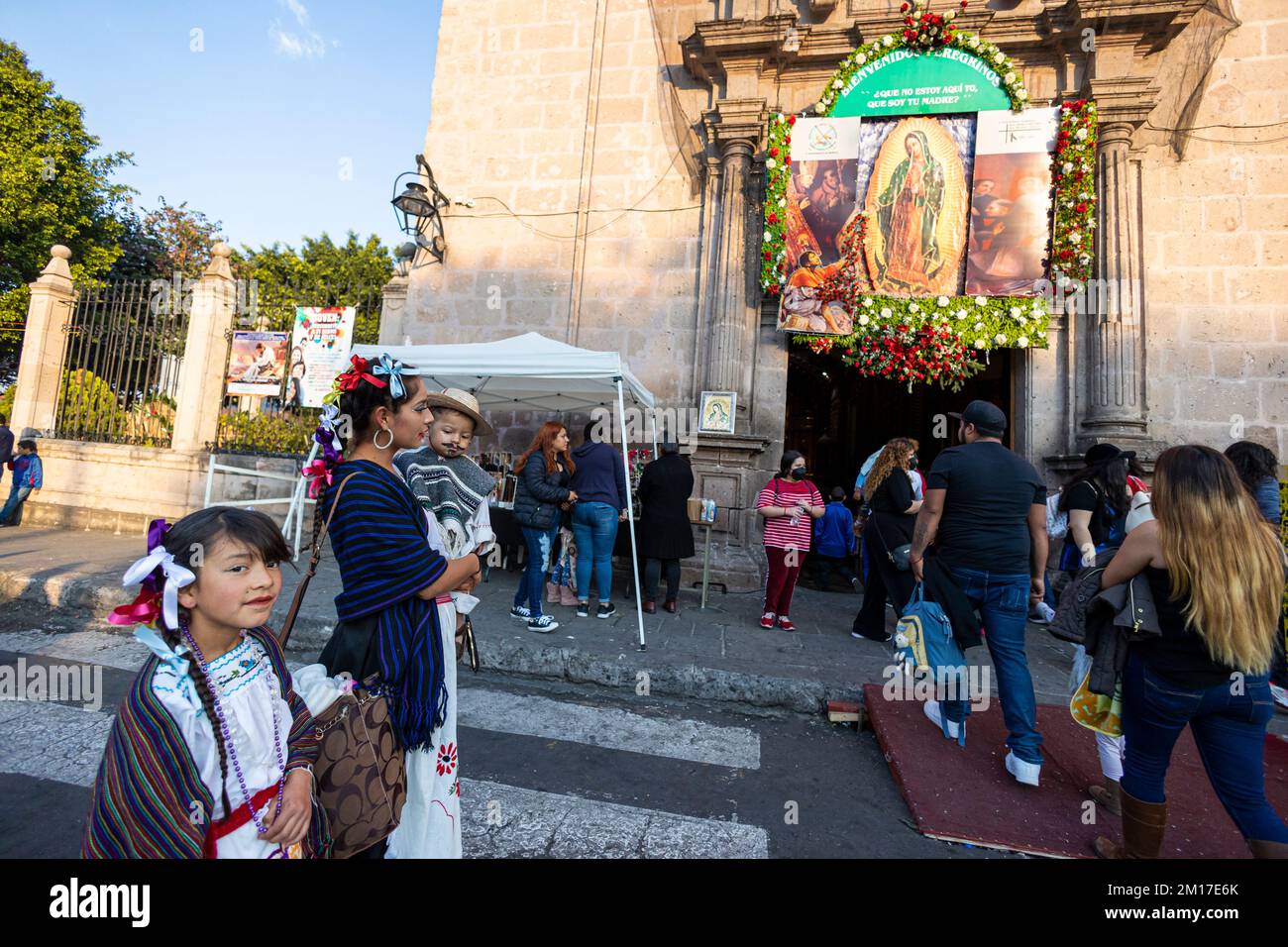 Morelia, Mexico, 10 Dec 2022, A mother and her children arrive at the ...