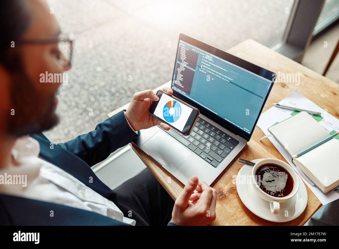 Young developer programmer freelancer in glasses working on project in ...