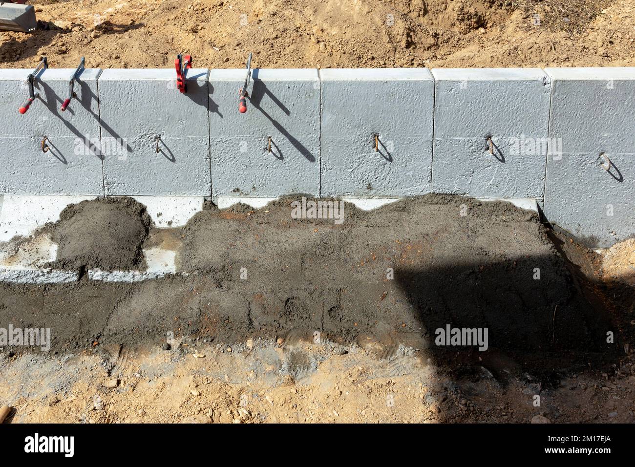 detail of curbstones fixed in a concrete bed in detail at the ...