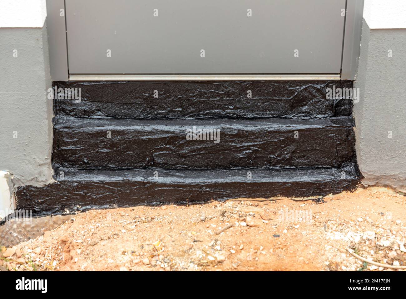 detail of insulation with Bitumen at an entrance door at the ...