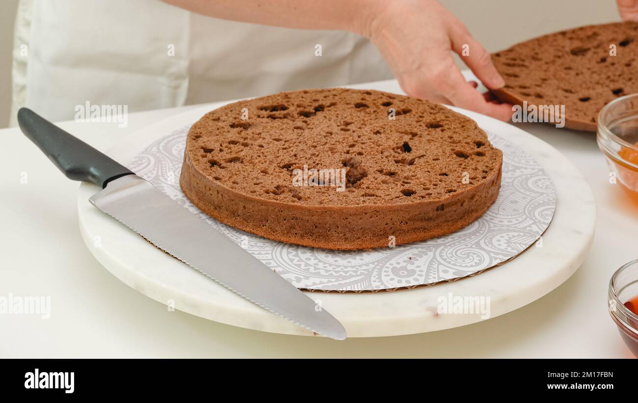 Chocolate cake step by step recipe. Woman hands slicing fresh baked ...