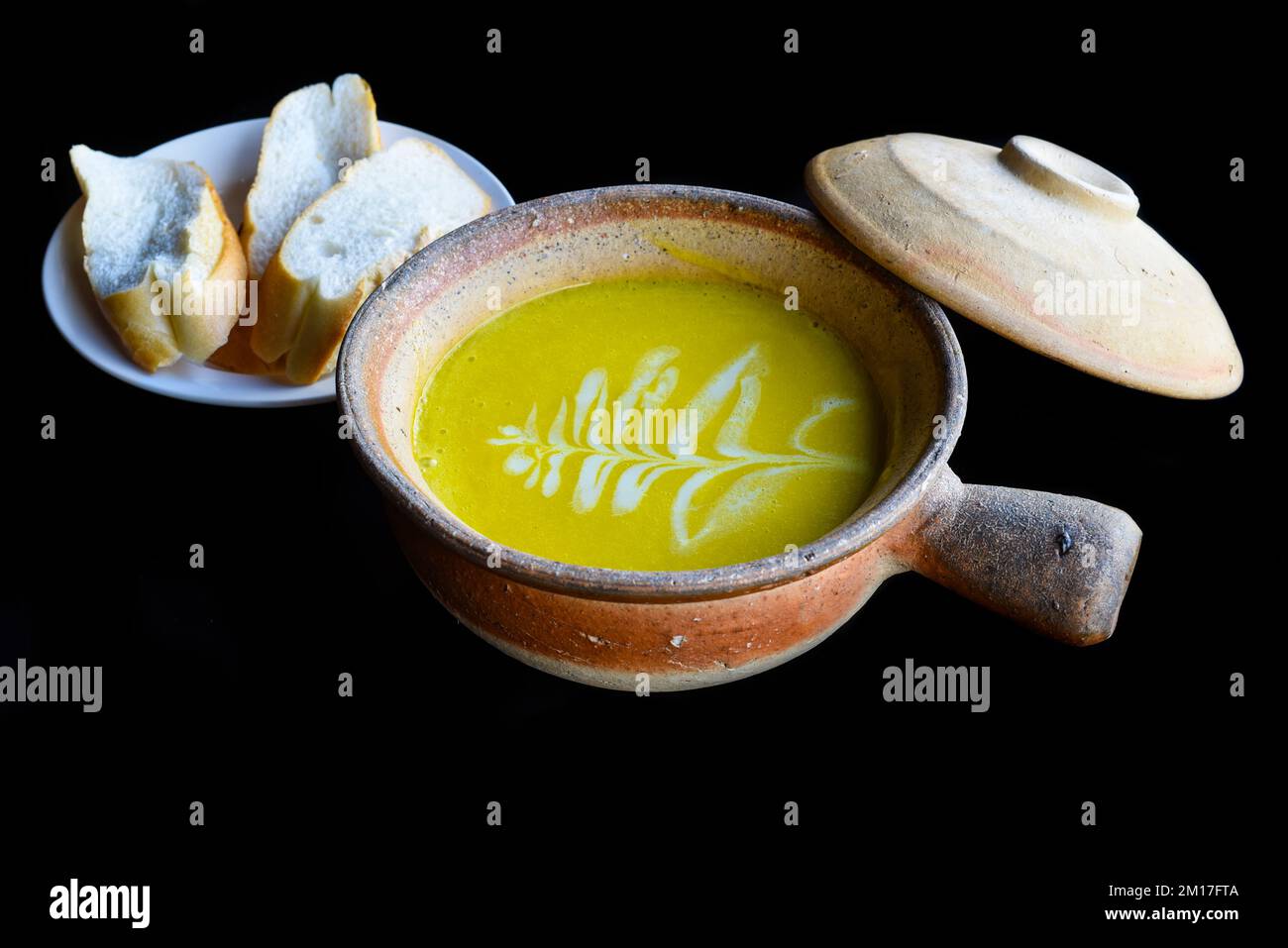 Pumpkin Soup isolated on black background side view Stock Photo - Alamy