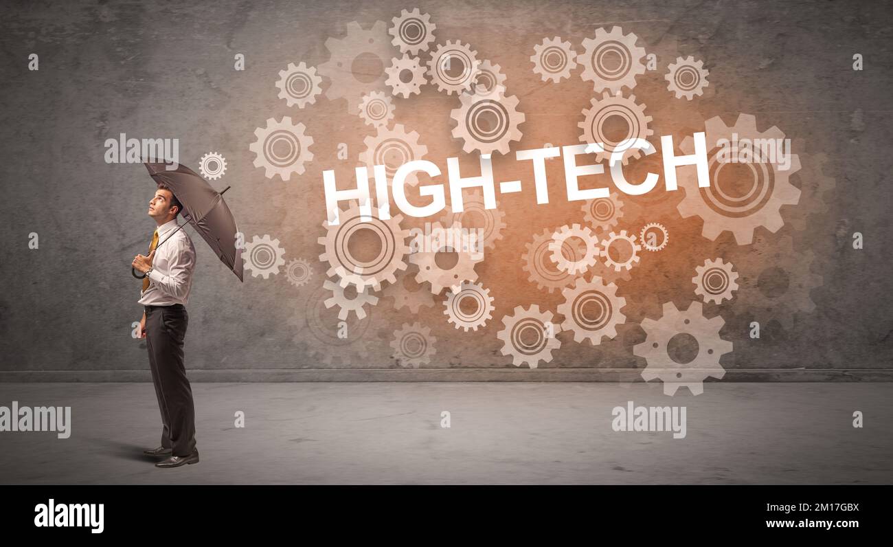 Businessman defending with umbrella concept Stock Photo - Alamy