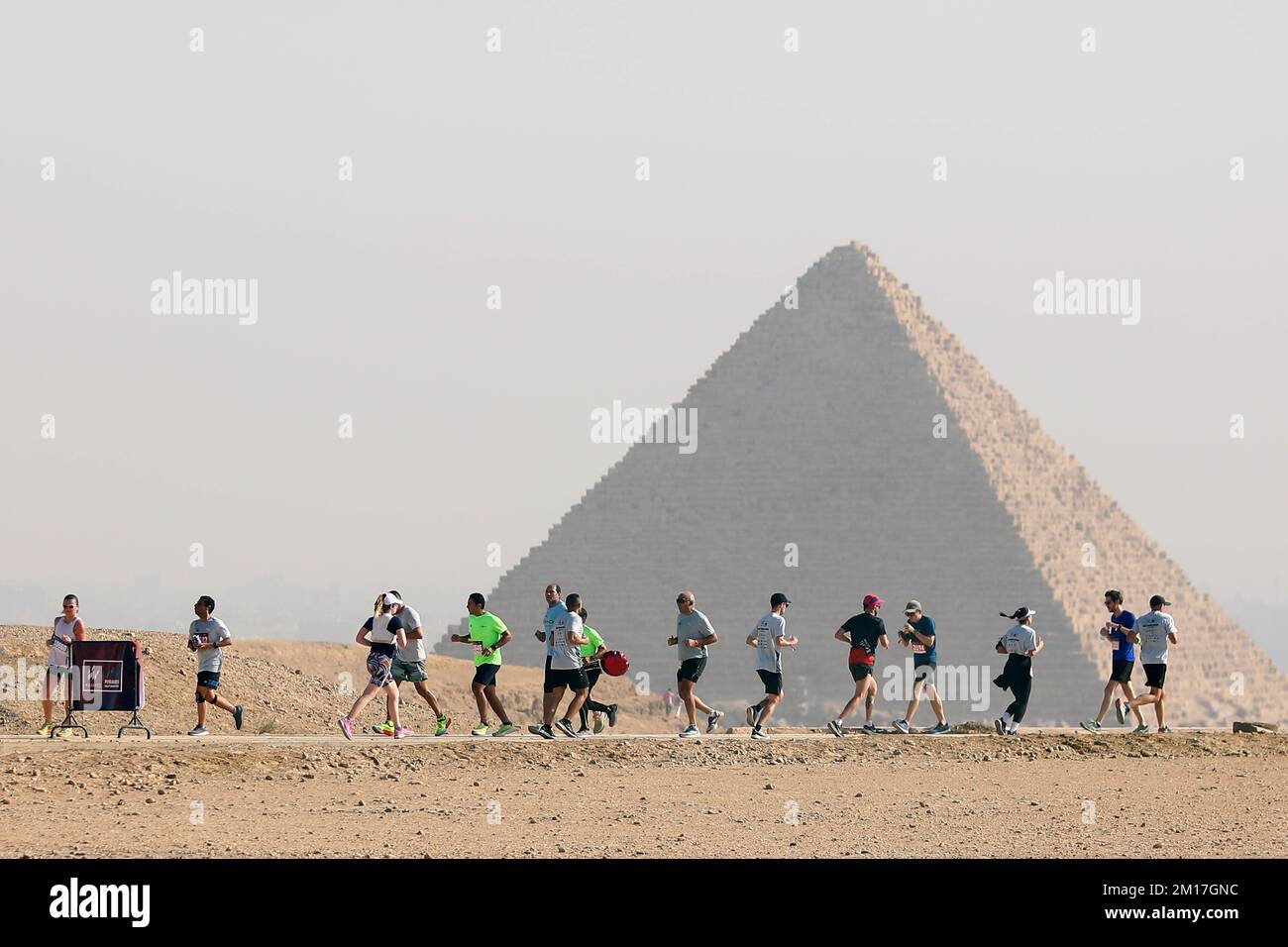 Cairo, Egypt. 10th Dec, 2022. Runners participate in the Pyramids Half ...