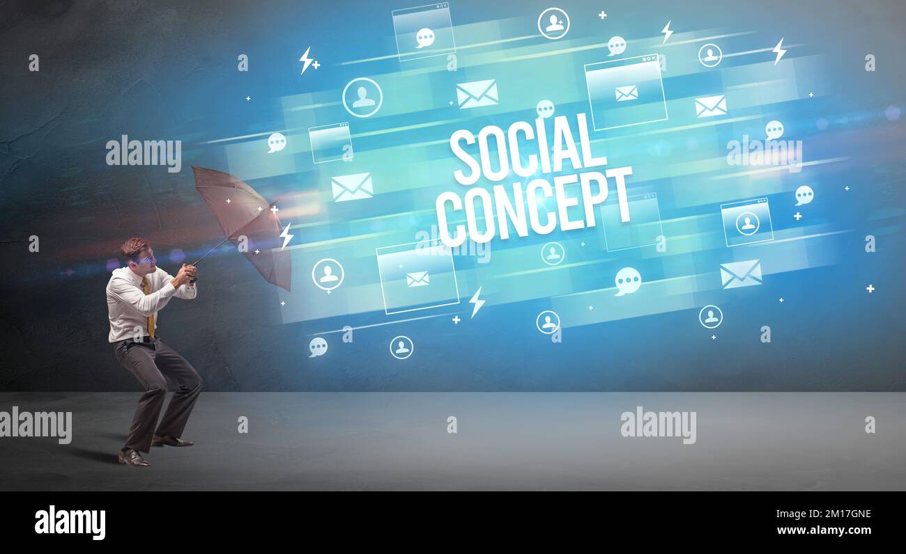 businessman defending with umbrella concept Stock Photo - Alamy