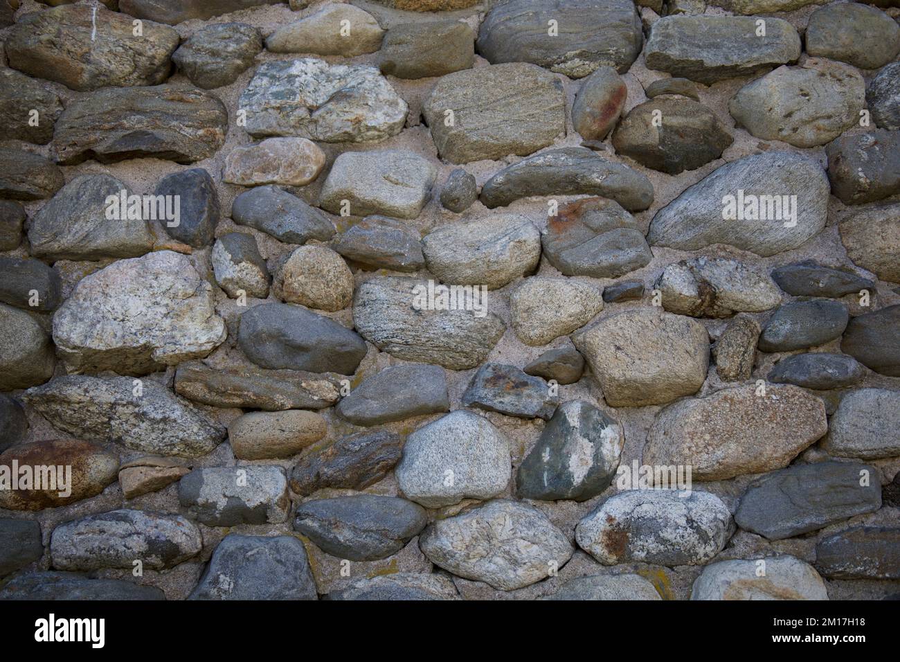 Different sized rocks, with various shapes and colors, arranged as the ...