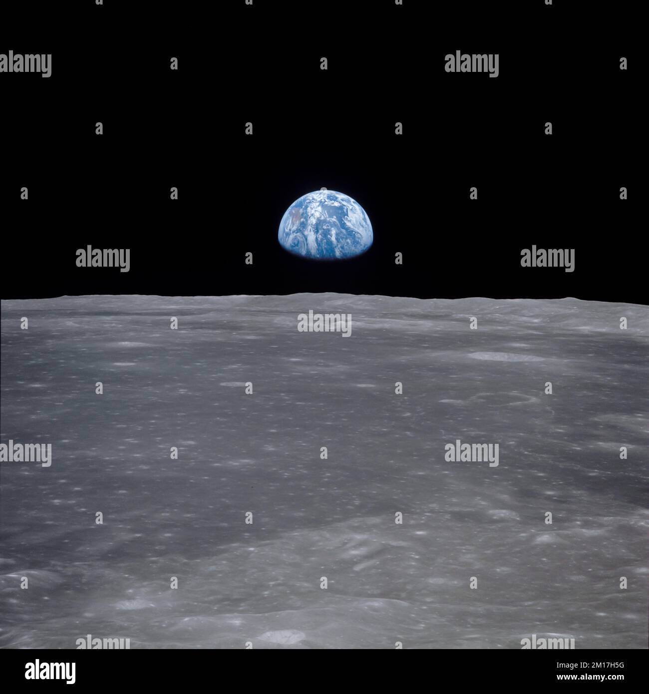 Earth seen distant from space from the surface of the moon. Digitally ...