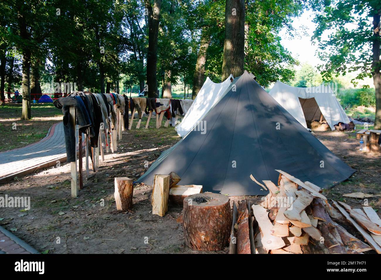 Defocus green tents on the history festival. Military camping in a rest ...