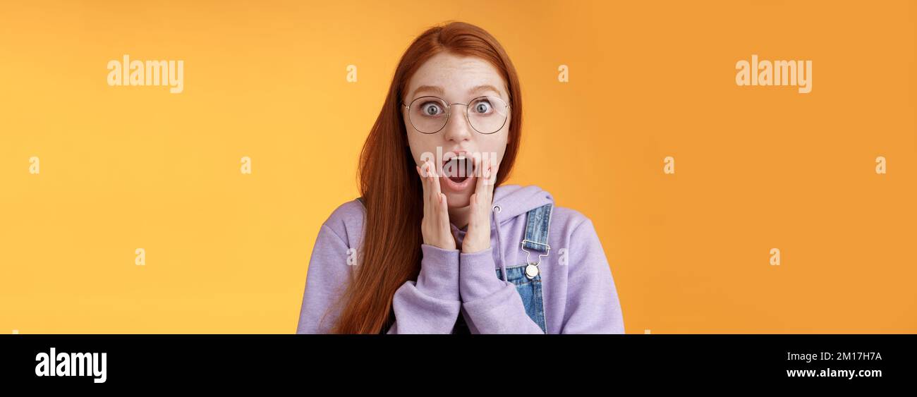 Shocked impressed redhead girlfriend drop jaw gasping screaming wow omg ...