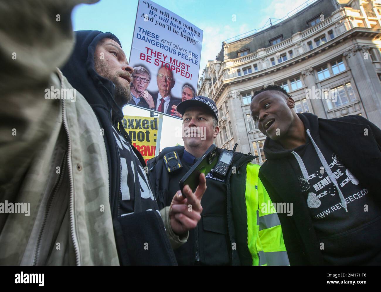 London, UK. 01st Jan, 2000. Protesters explain to a police officer why ...