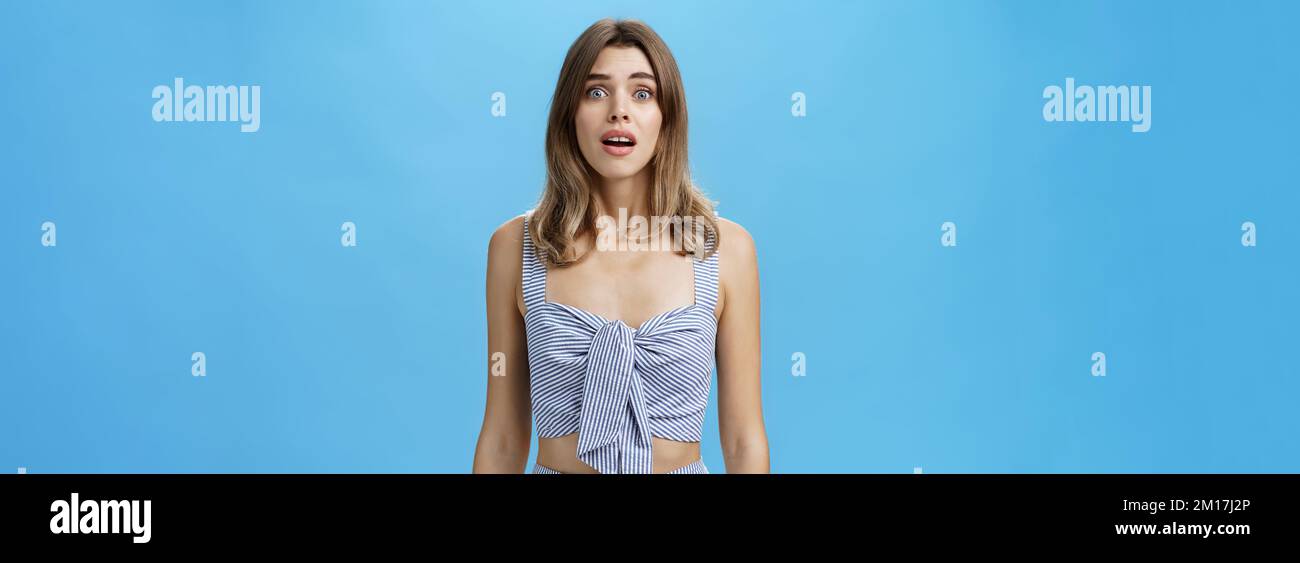 Portrait of silly desperate and upset cute attractive woman with diastema open mouth gasping and ...