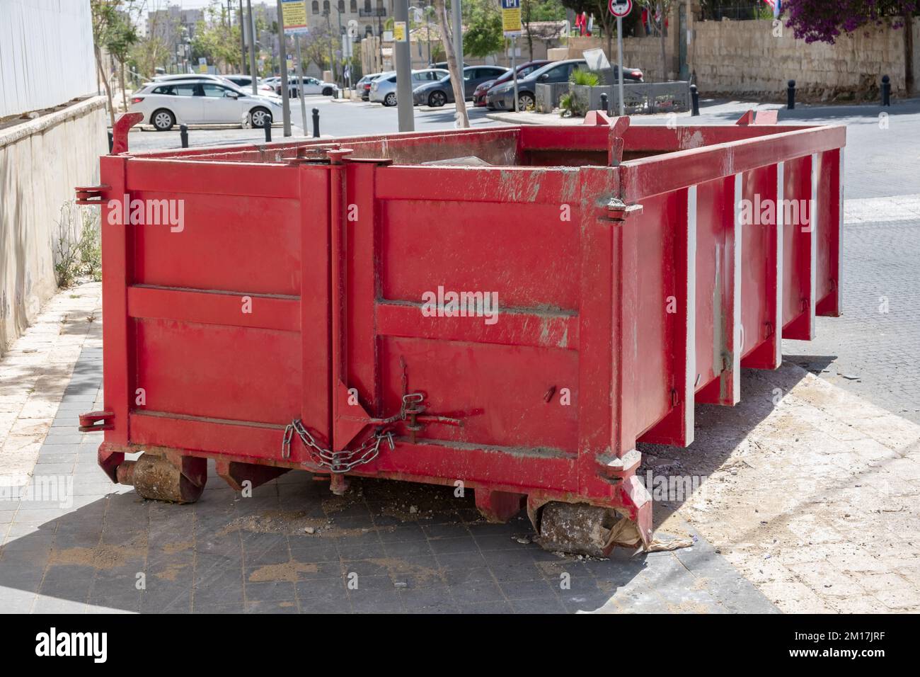 Construction waste in a half empty Red dumpster. Waste metal tank ...