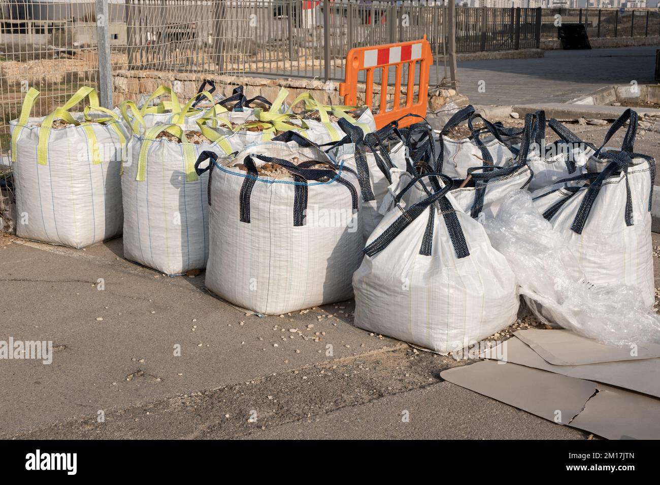 Large construction bags filled with construction debris on the ...