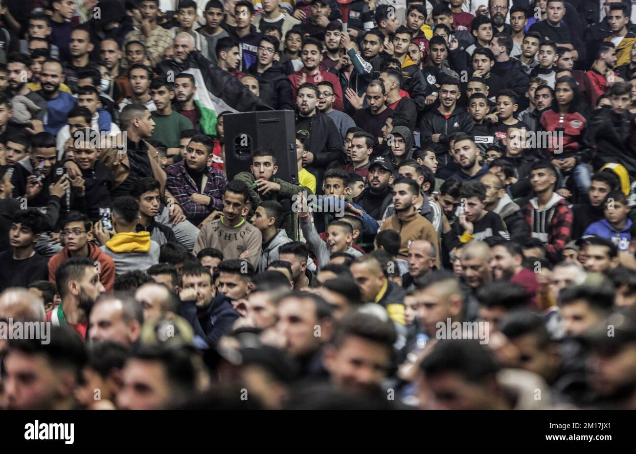 Gaza, Palestine. 10th Dec, 2022. Palestinians watch the live broadcast ...