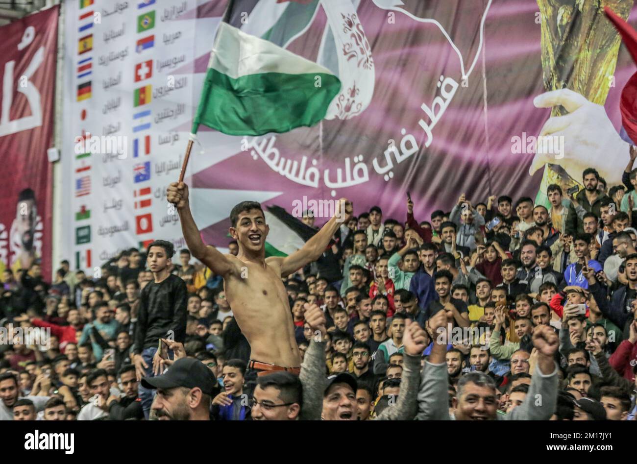 Gaza, Palestine. 10th Dec, 2022. Palestinians watch the live broadcast ...