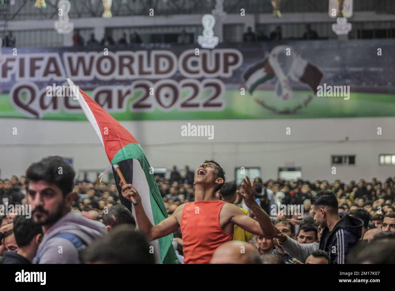 Gaza, Palestine. 10th Dec, 2022. Palestinians watch the live broadcast ...