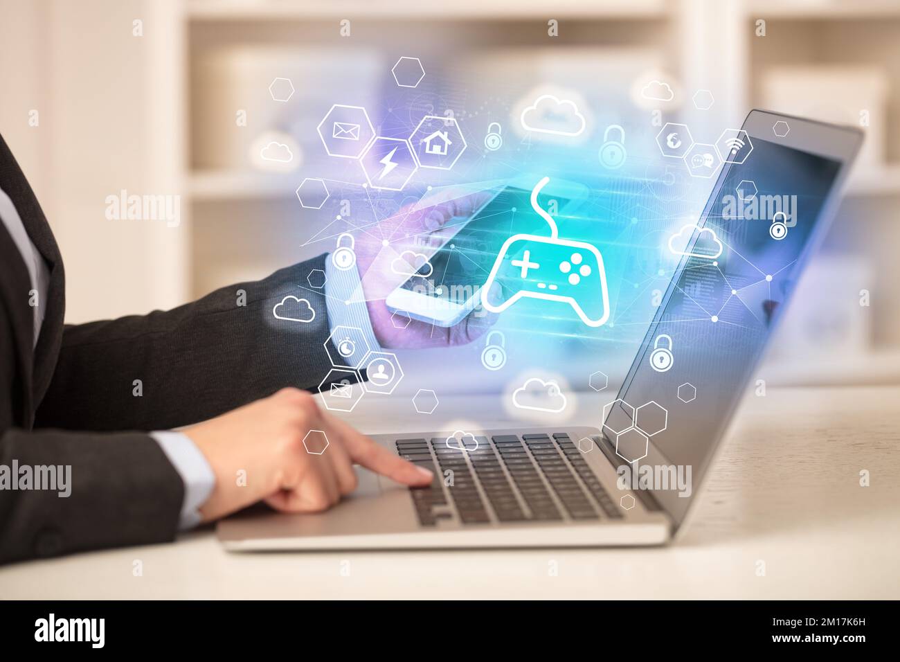 Hands working on laptop with digital icons Stock Photo - Alamy
