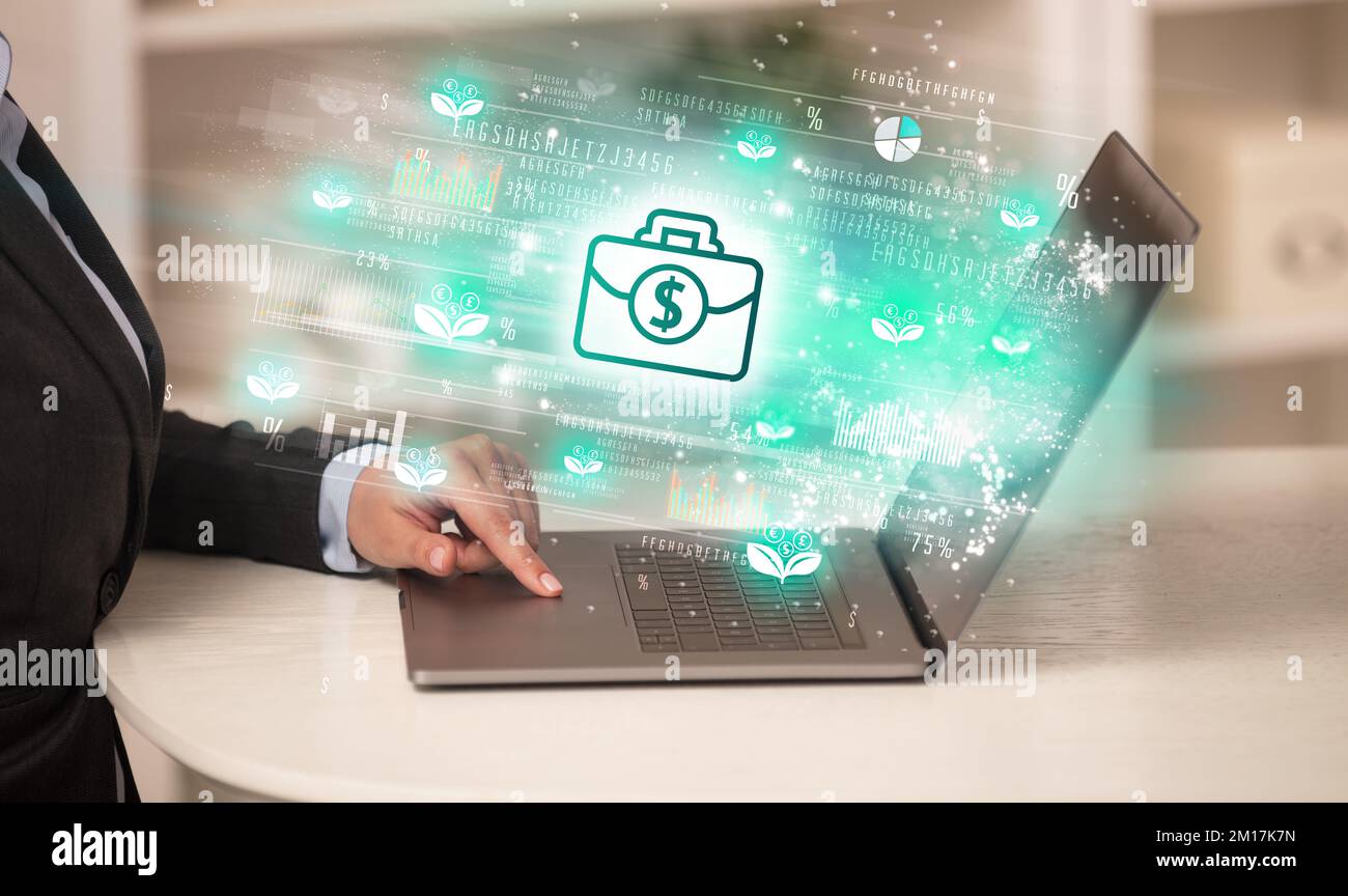 Young man watching stock market on laptop Stock Photo - Alamy