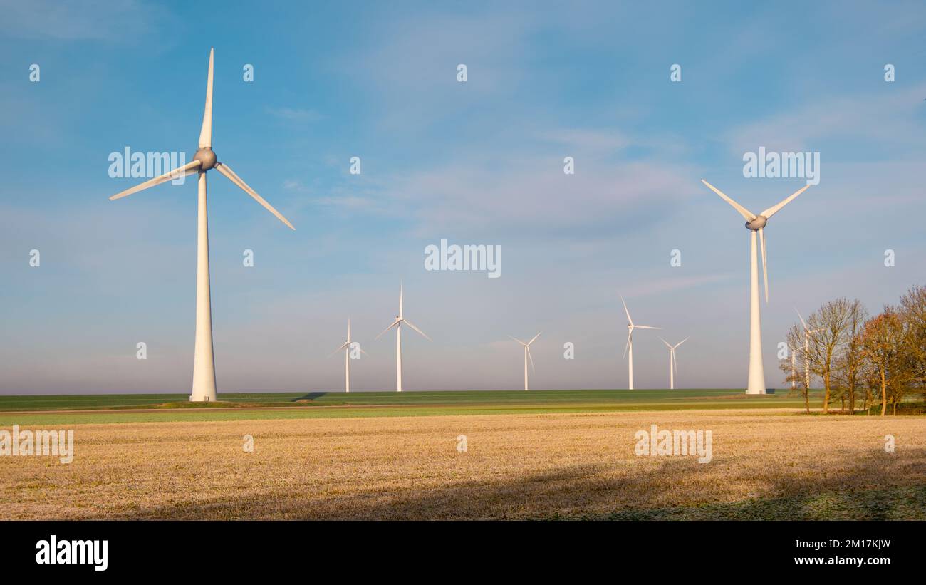 Windmill park with wind mill turbines during winter generating ...