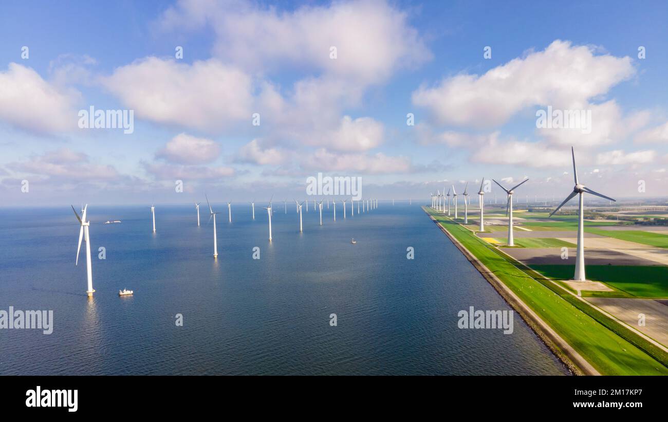 Aerial view at Windmill park with windmills turbines on a cloudy day ...