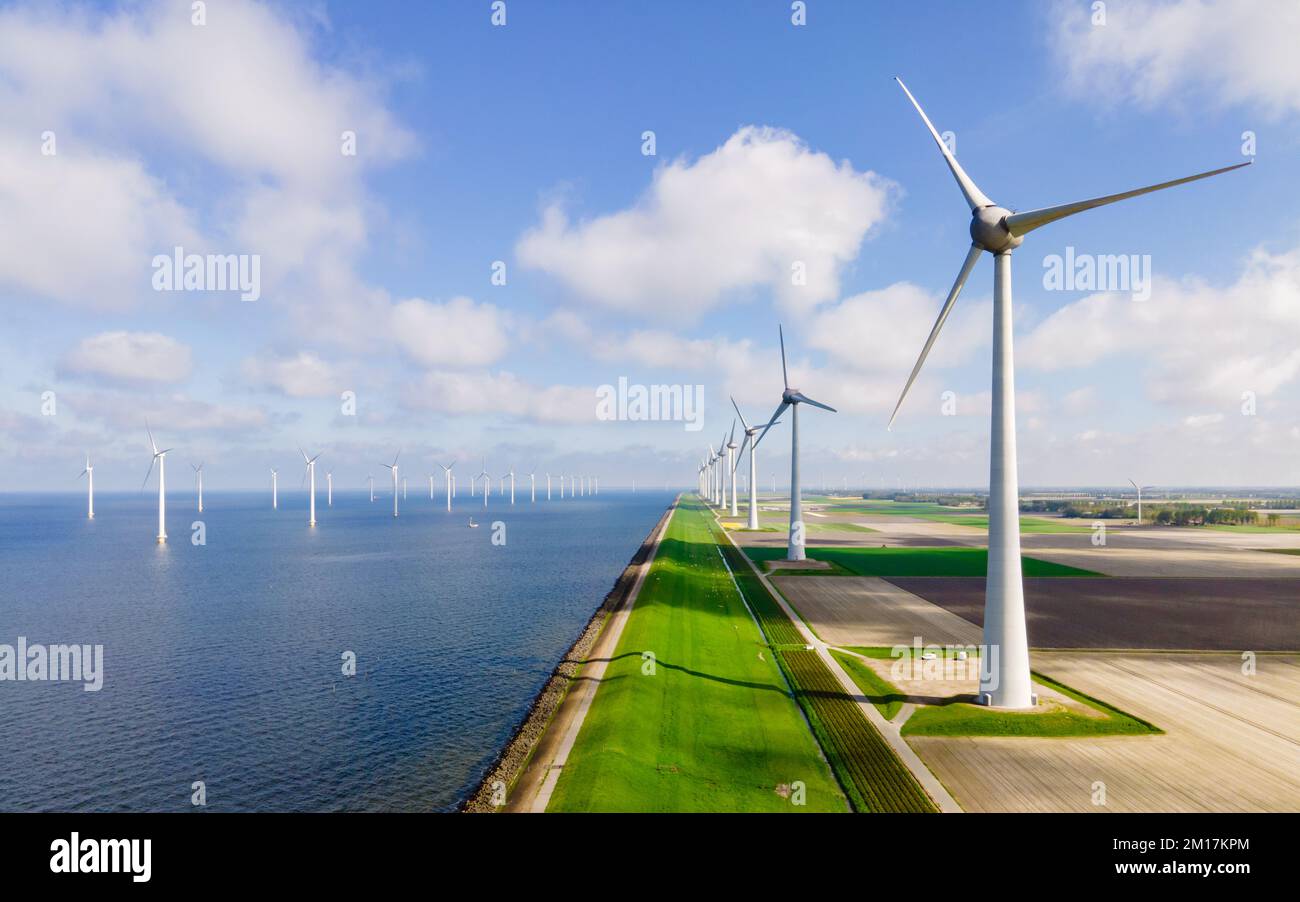 Aerial view at Windmill park with windmills turbines on a cloudy day ...