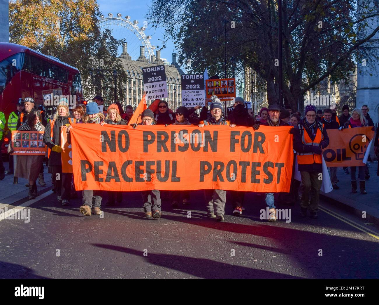 Protesters march with a 'No prison for peaceful protest' banner during ...