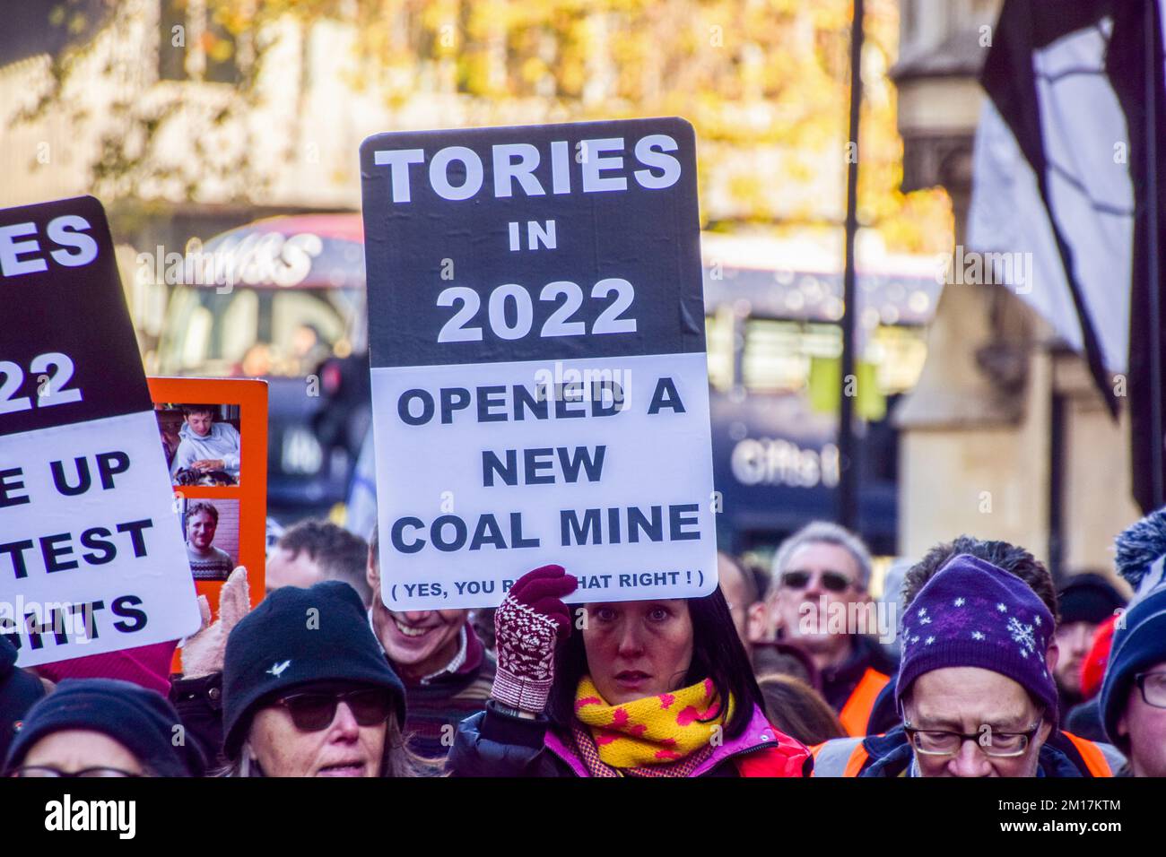 London, UK. 10th Dec, 2022. A protester holds a placard stating that ...