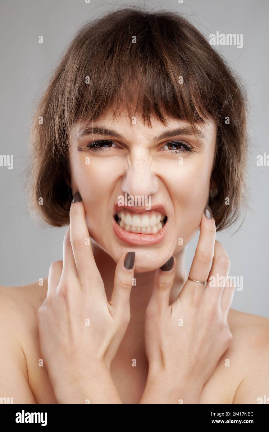 beauty portrait of a brunette girl with short hairstyle. screaming and ...