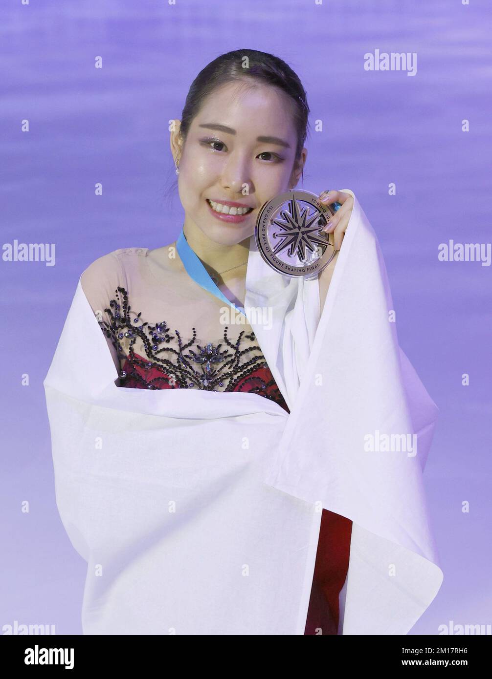 Japan's Mai Mihara poses after winning gold at the Grand Prix Final ...