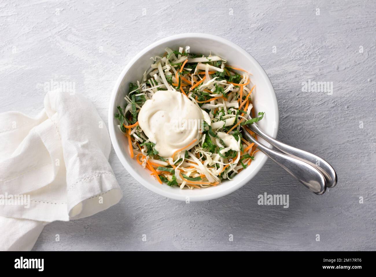 Homemade healthy cole slow salad with kale in white bowl on gray ...