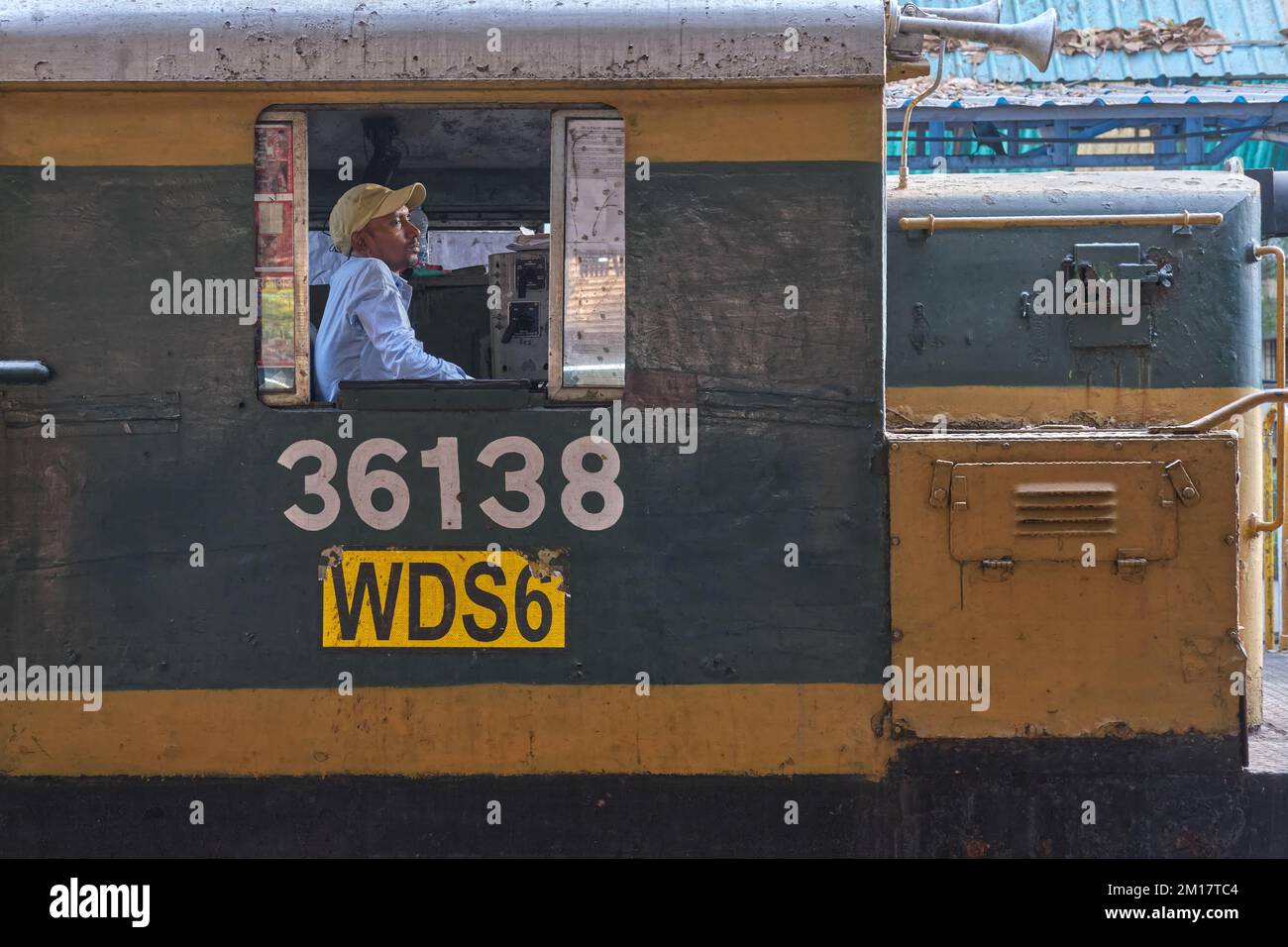 A locomotive driver sitting in his locomotive (type WDS-6); at ...