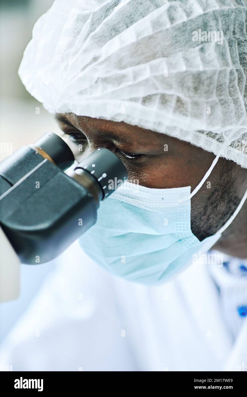 Scientist looking in microscope hi-res stock photography and images - Alamy