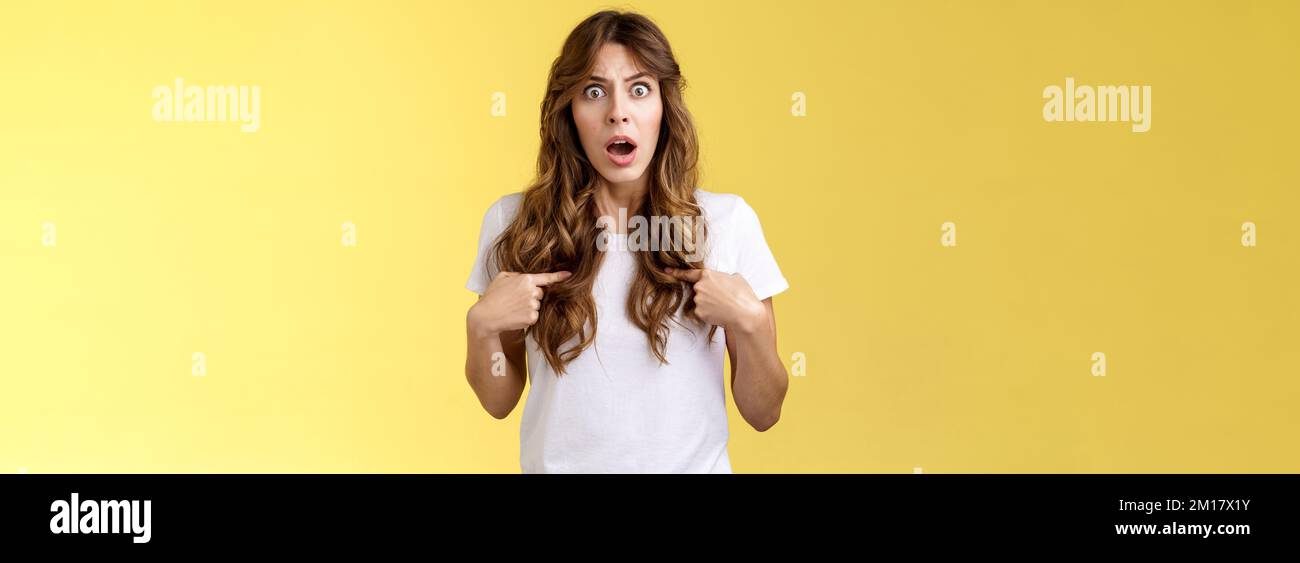 Shocked concerned questioned curly-haired girl drop jaw gasping stare ...