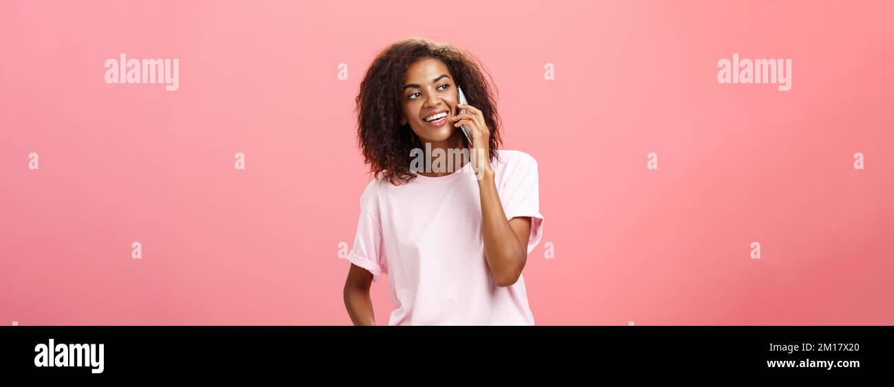 Girl calling friend to meet up. Portrait of charming friendly and ...