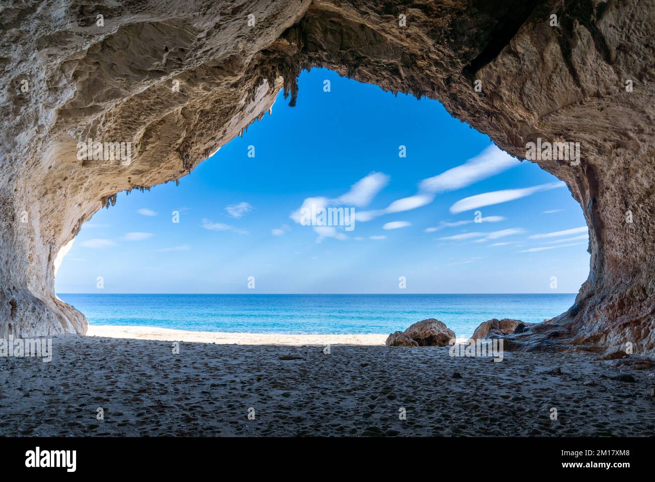 The view out of one of the many seaside caves at the beach of Cala Luna ...