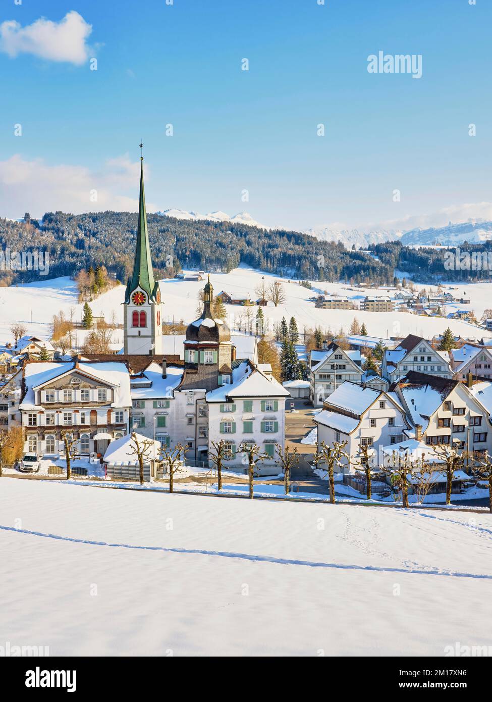 Snow-covered village view with typical Appenzell houses facing south ...