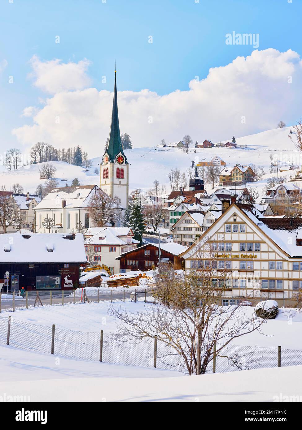 Snow-covered village view with typical Appenzell houses facing south ...